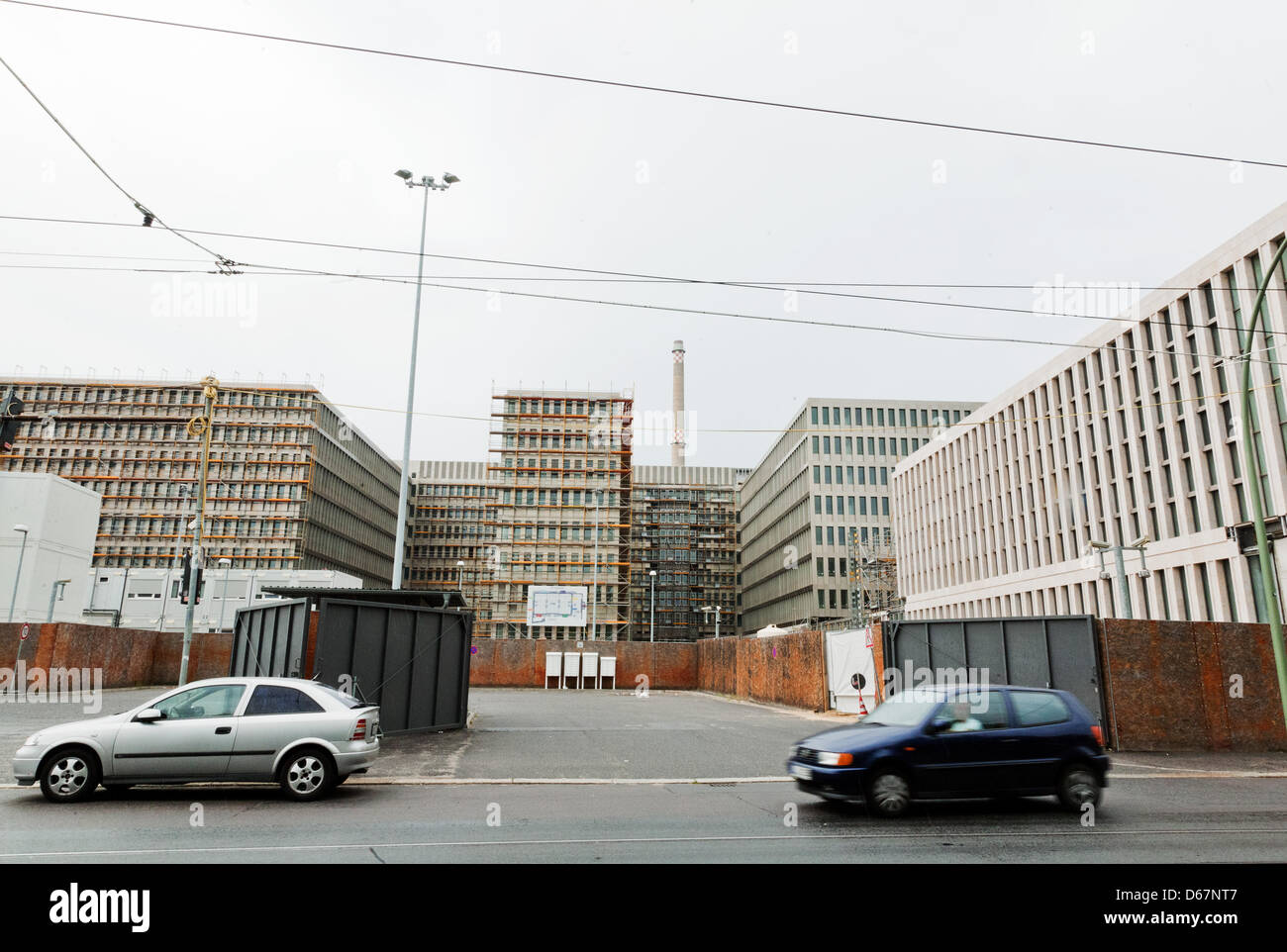 A car passes by the construction site of the future Federal ...