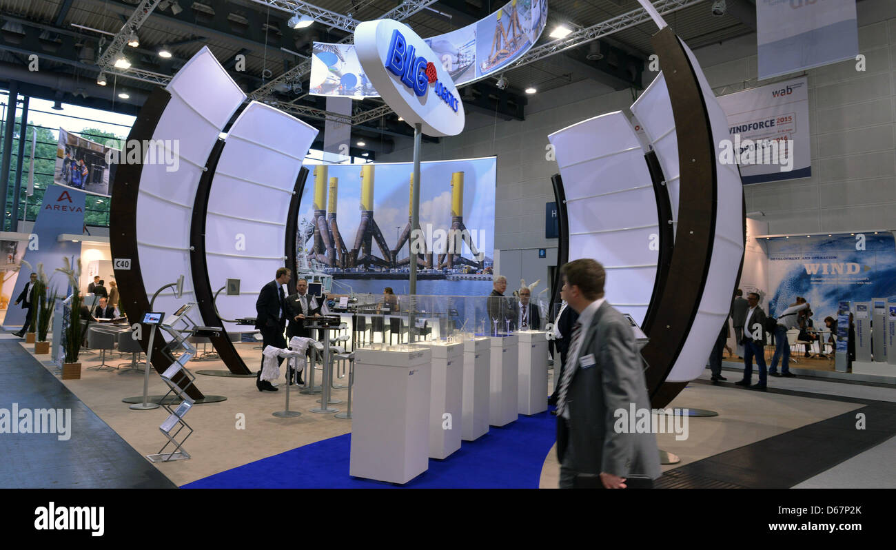 Visitors view exhibits at the offshore wind industry conference and ...