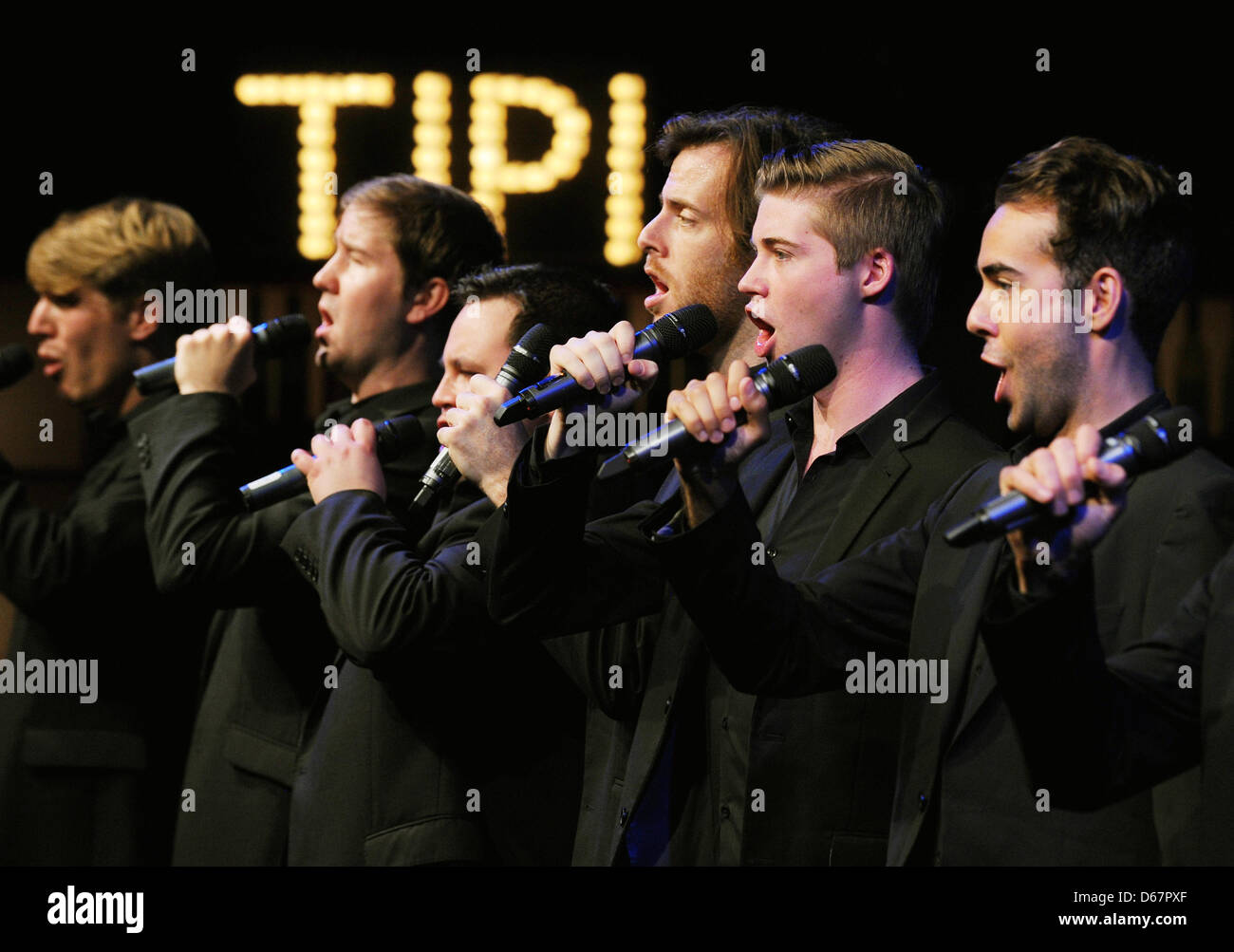 The international members of "The 12 Tenors" stand on the stage of ...