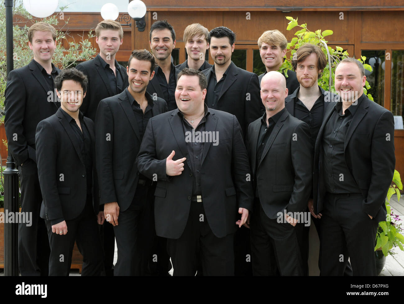 The international members of "The 12 Tenors" stand on the stage of ...