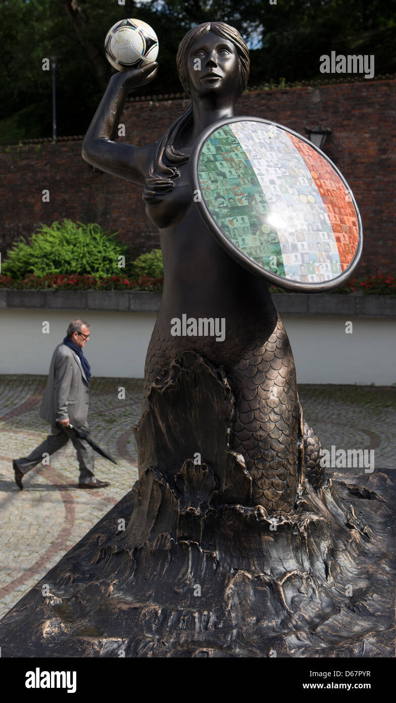 A Mermaid sculpture with a shield in the colours of the italian flag ...