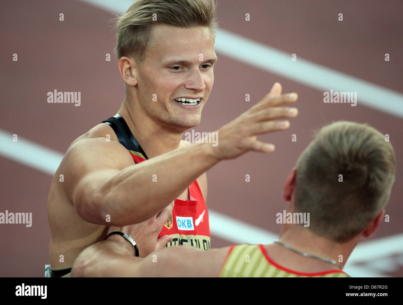 Pascal Behrenbruch (L) of Germany reacts with his teammate Mathias ...