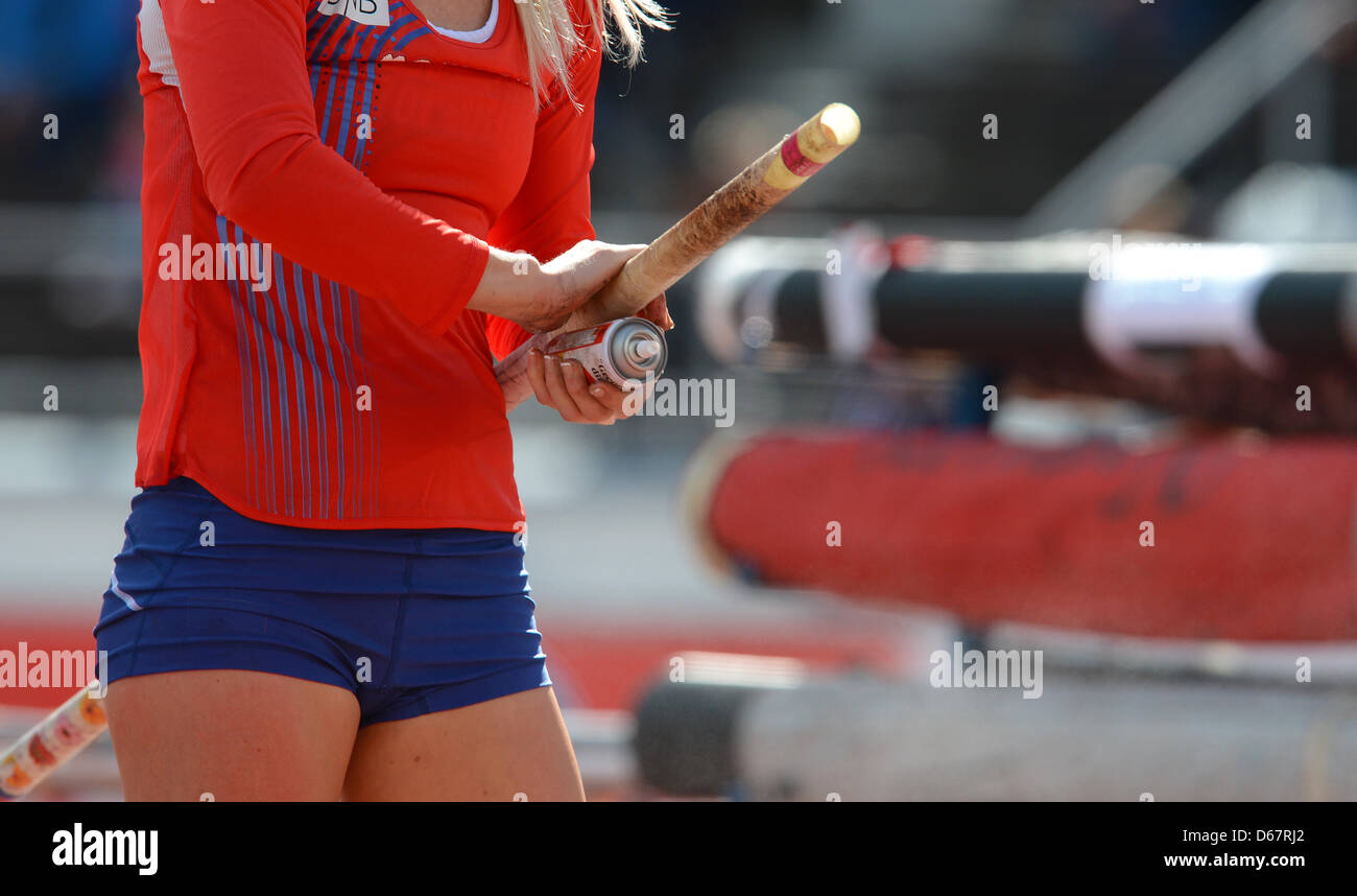 A competitor prepares a pole during the women's Pole Vault ...