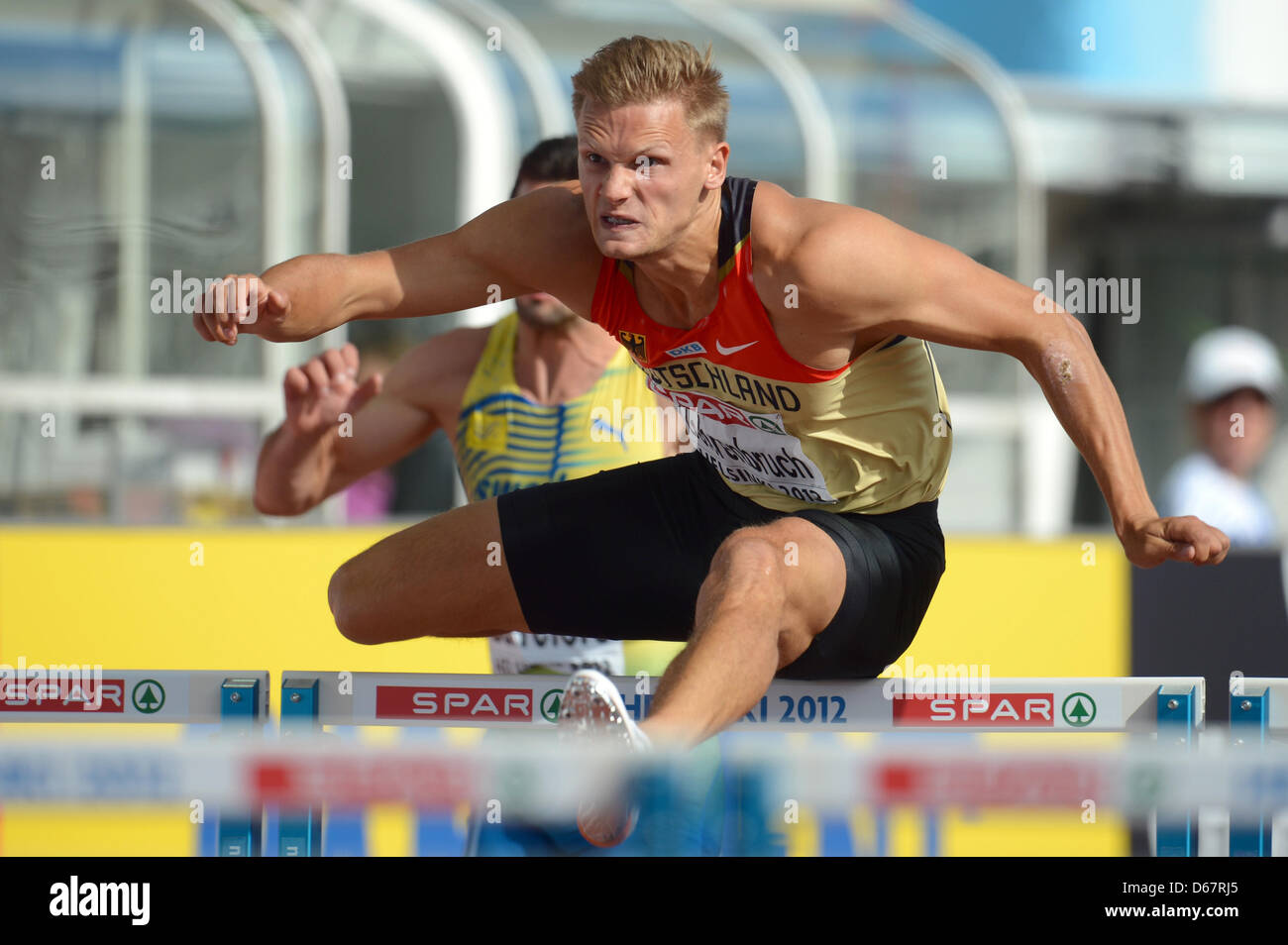 Pascal Behrenbruch of Germany competes in the 110 Meter Hurdles ...