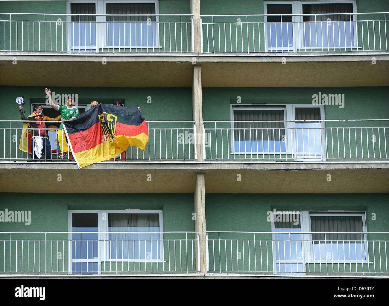 Supporters of the German national soccer team sing on a balcony of a ...