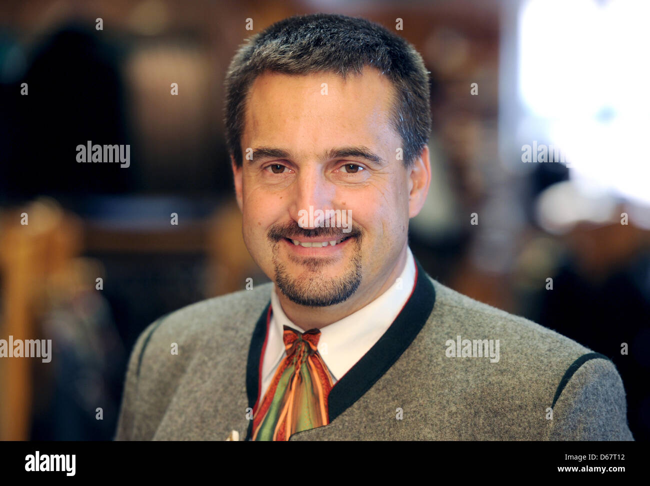 Former tobogganist Georg hackel wears a jacket from his collection ...
