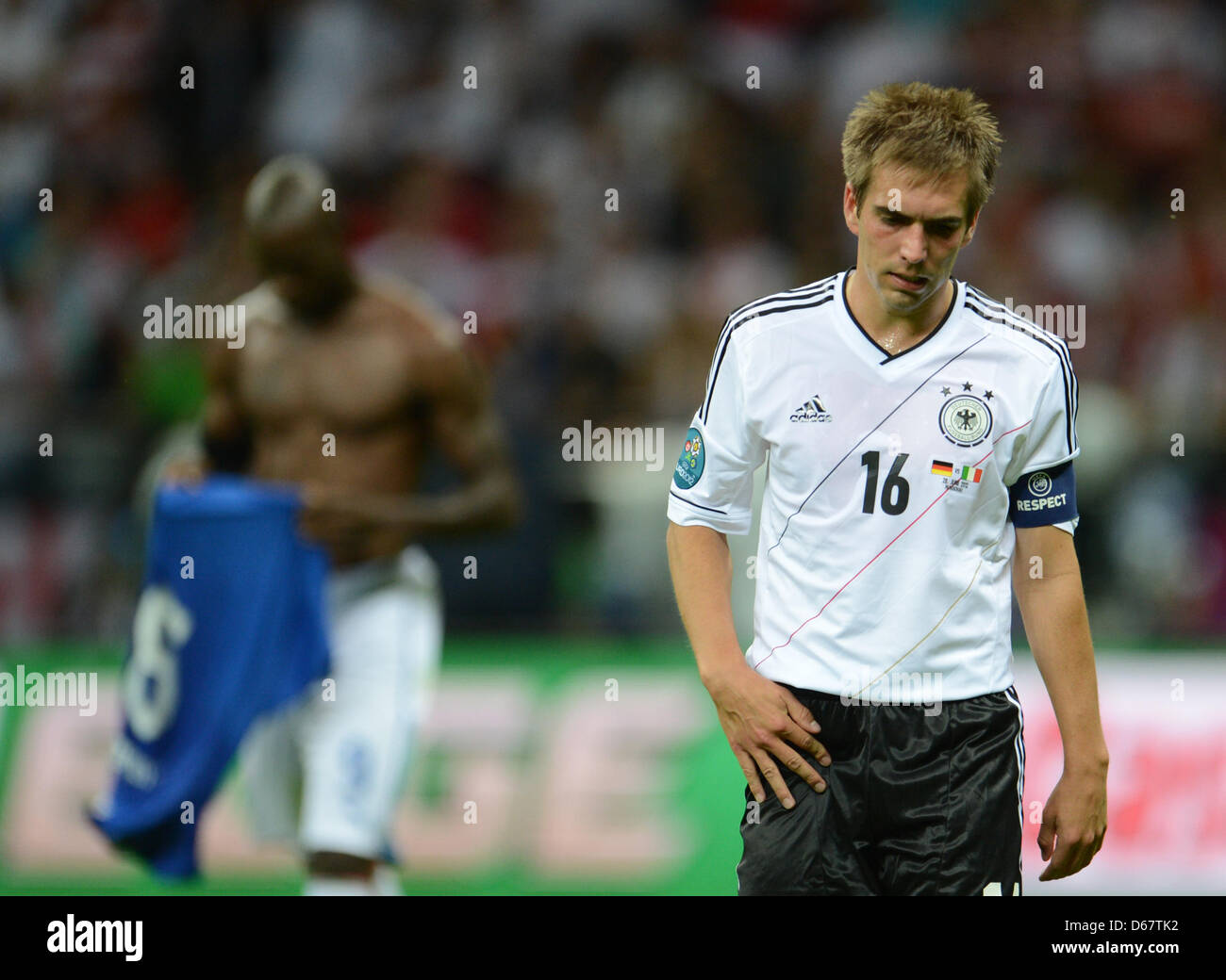 Germany's Philipp Lahm (R) reacts during the UEFA EURO 2012 semi-final ...