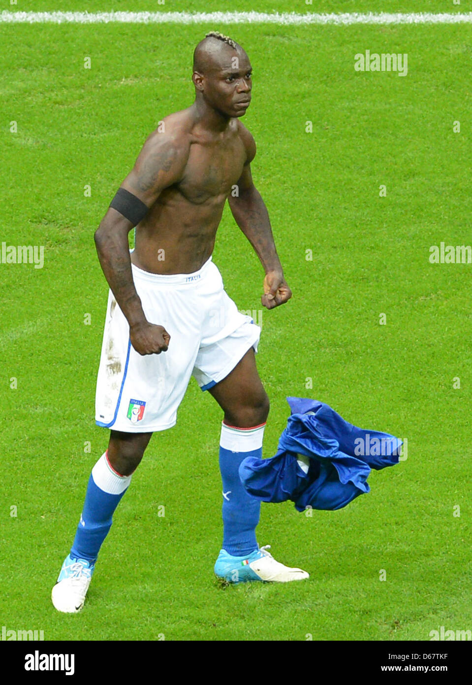 Italian forward Mario Balotelli celebrates after scoring the 0-2 during ...