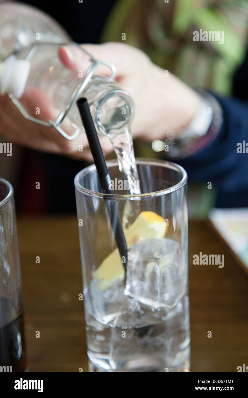 Water pouring pour glass bottle hi-res stock photography and images - Alamy