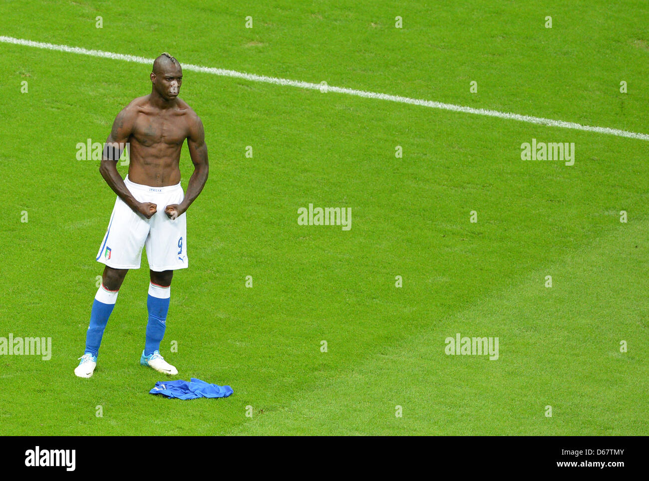Italian forward Mario Balotelli celebrates after scoring the 0-2 during ...