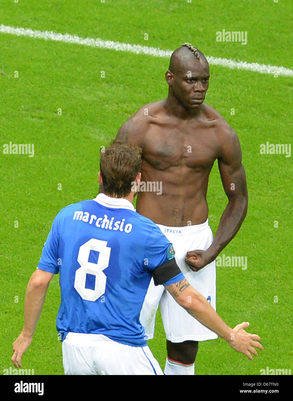 Italian forward Mario Balotelli (R) celebrates after scoring the 0-2 ...