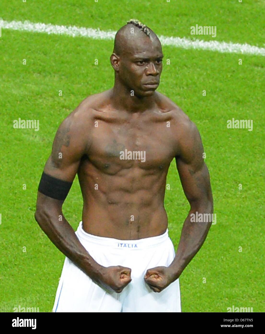 Italian forward Mario Balotelli celebrates after scoring the 0-2 during ...