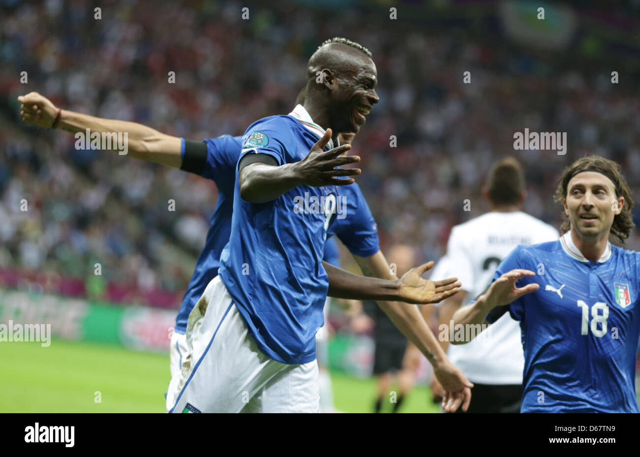 Italian forward Mario Balotelli (facing) celebrates after scoring the 0 ...