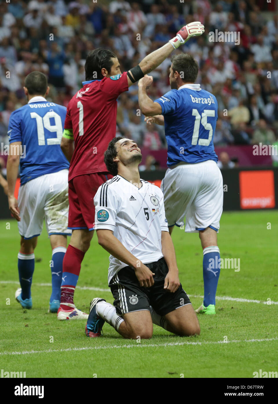 Germany's Mats Hummels (C) and Italy's goalkeeper Gianluigi Buffon (L ...
