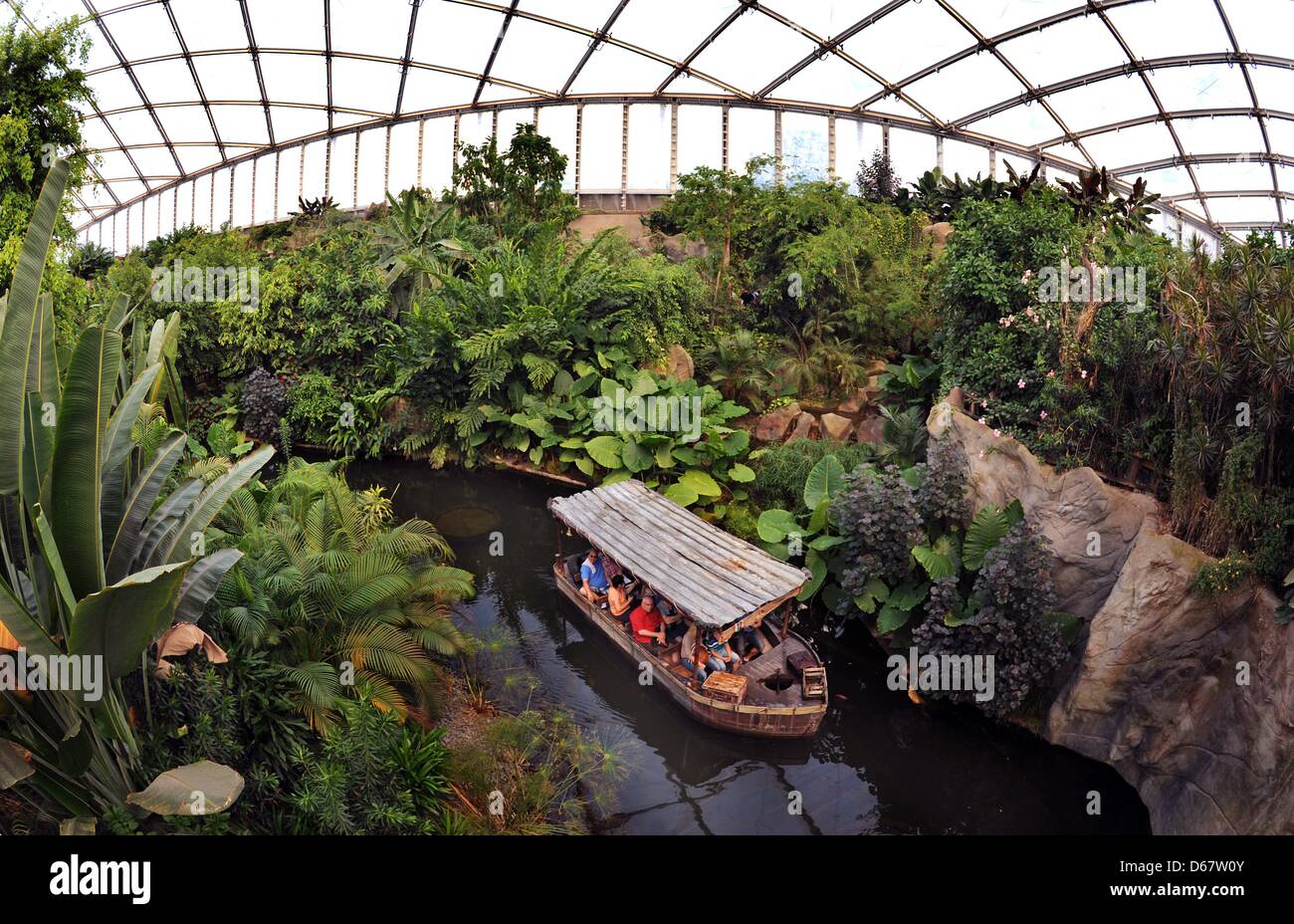 Visitors view the artificial tropical landscape from the river 'Gamanil ...