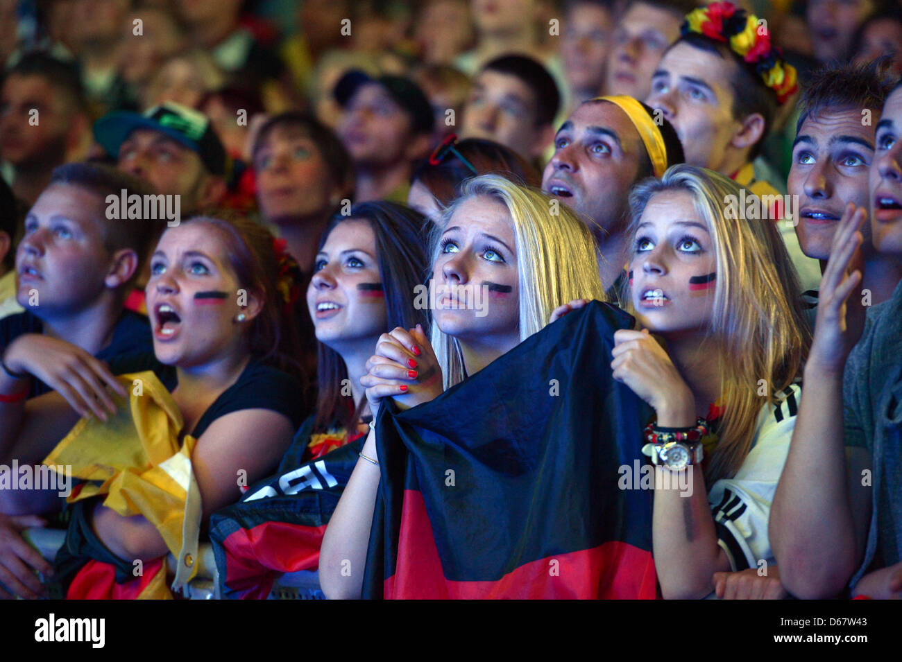 Soccer fans watch the semi final match of the UEFA EURO 2012 between ...