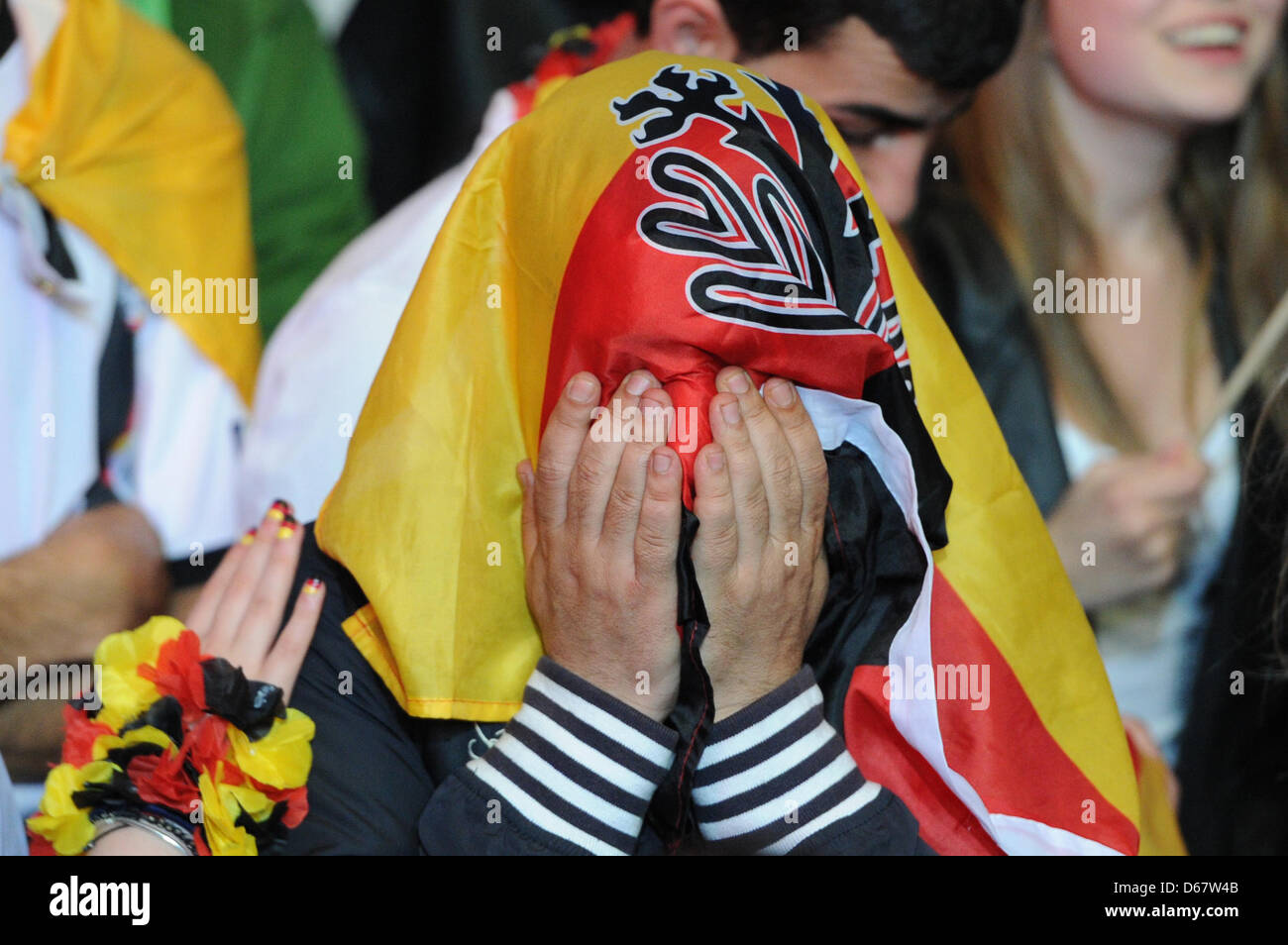Soccer fans watch the semi final match of the UEFA EURO 2012 between ...