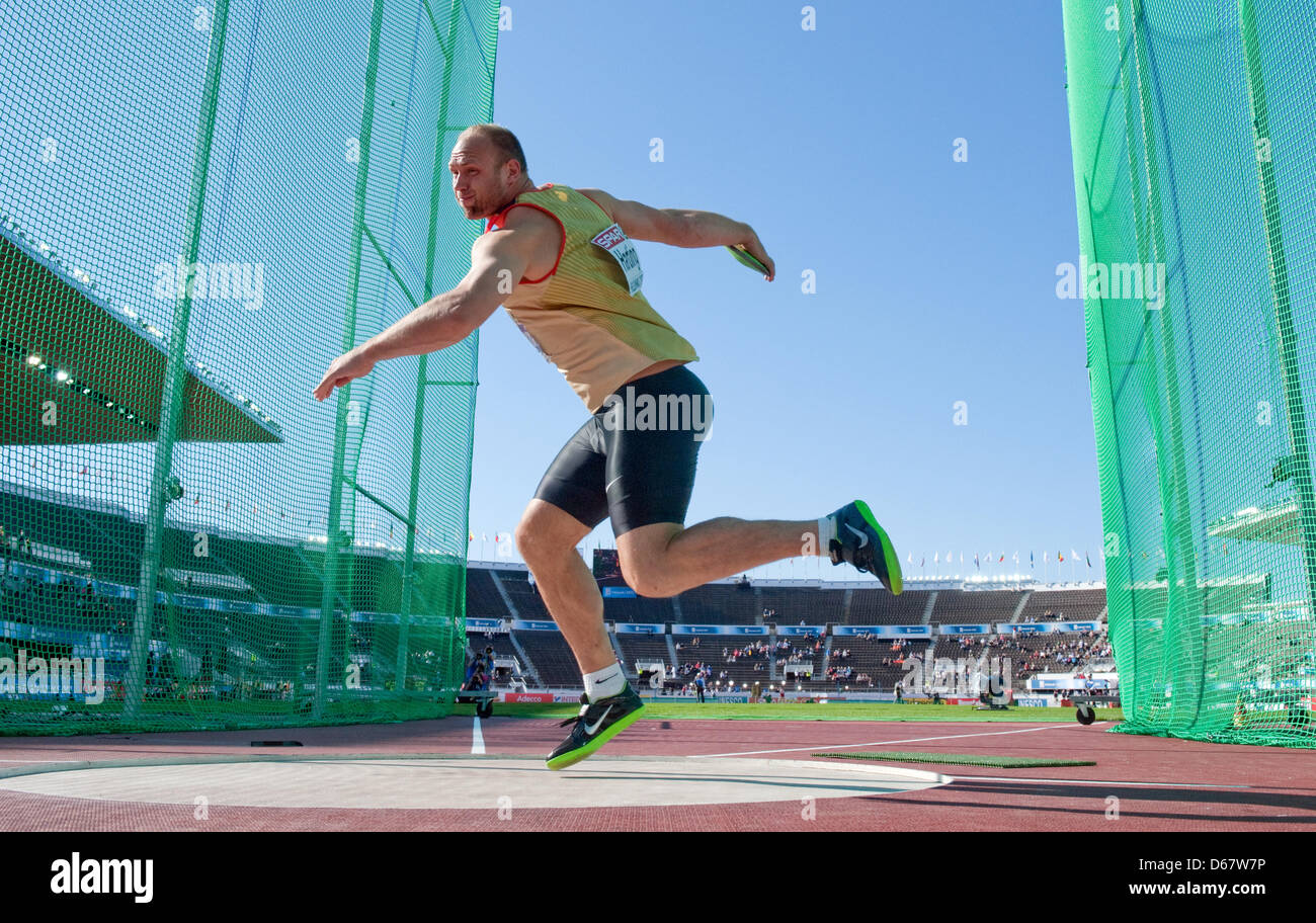Robert Harting of Germany competes at the discus qualification of the ...