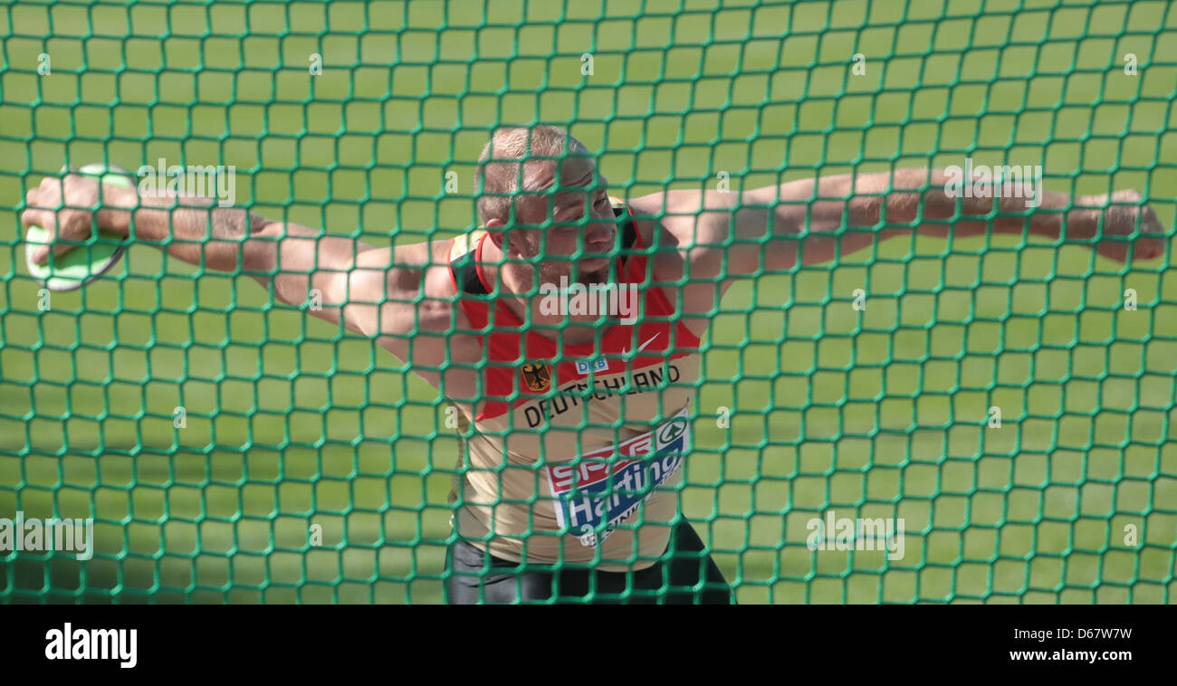 Robert Harting of Germany competes at the discus qualification of the ...