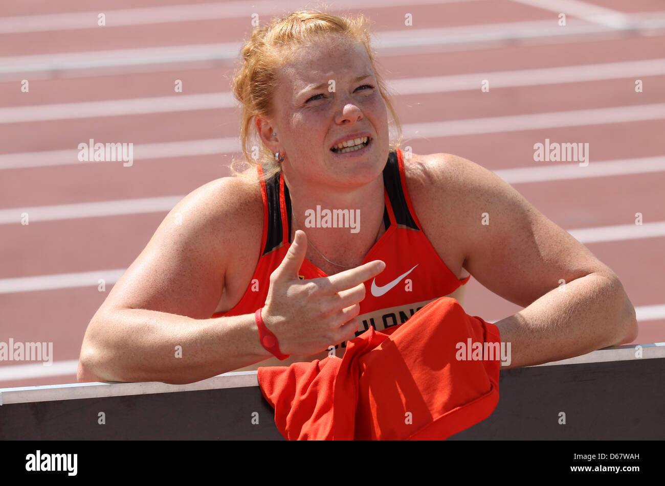 Betty Heidler of Germany chats to her coach during the women's Hammer ...