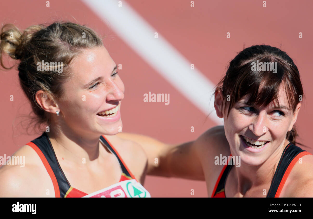 Caroline Schaefer smiles next to her team mate Claudia Rath (r) of ...