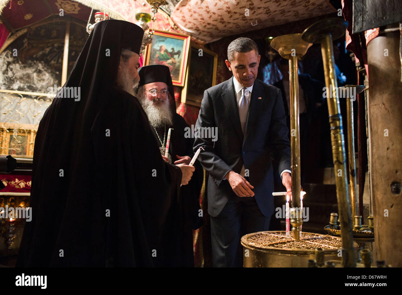 United States President Barack Obama lights candles as he tours the ...