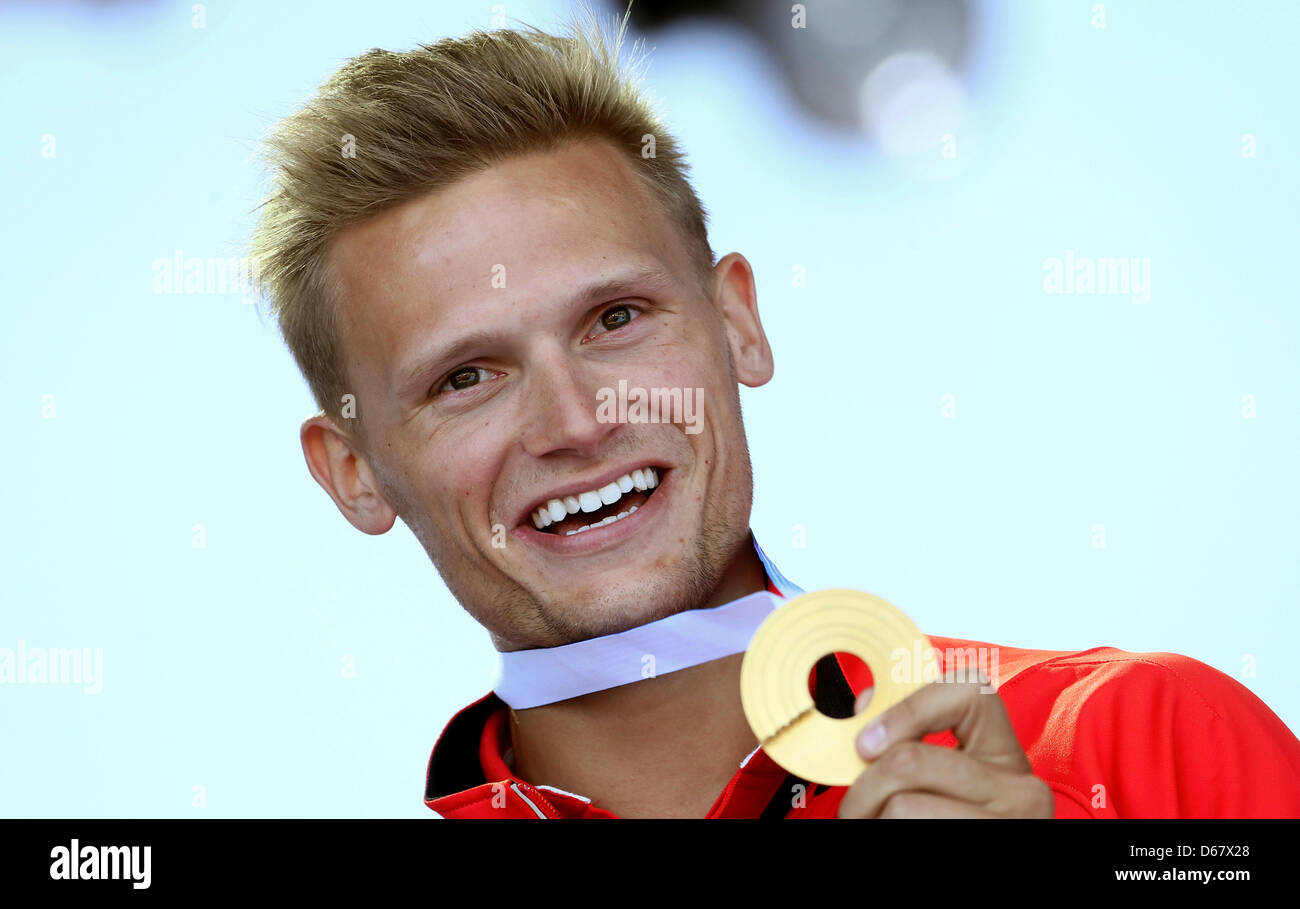 Pascal Behrenbruch of Germany displays his Gold Medal for the Decathlon ...