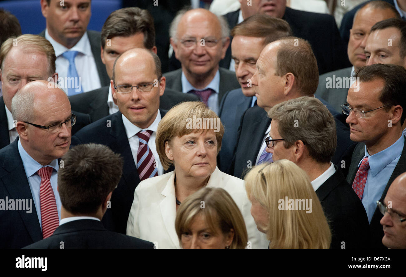 German Chancellor Angela Merkel (C) attends a session of the German ...