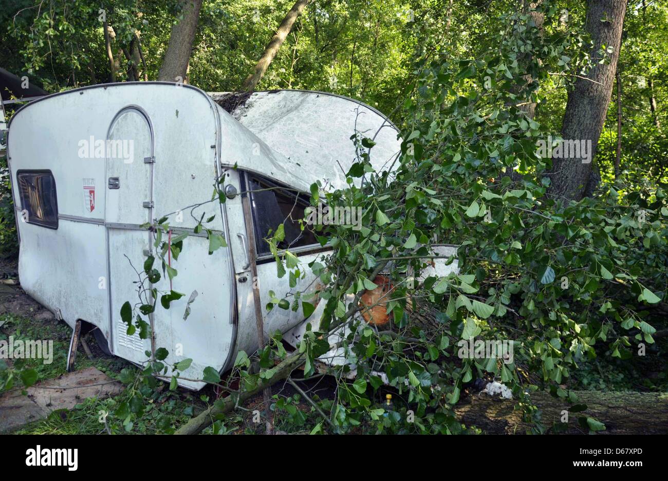 A camper is destroyed by fallen branches on a camp site in Gross Zecher ...