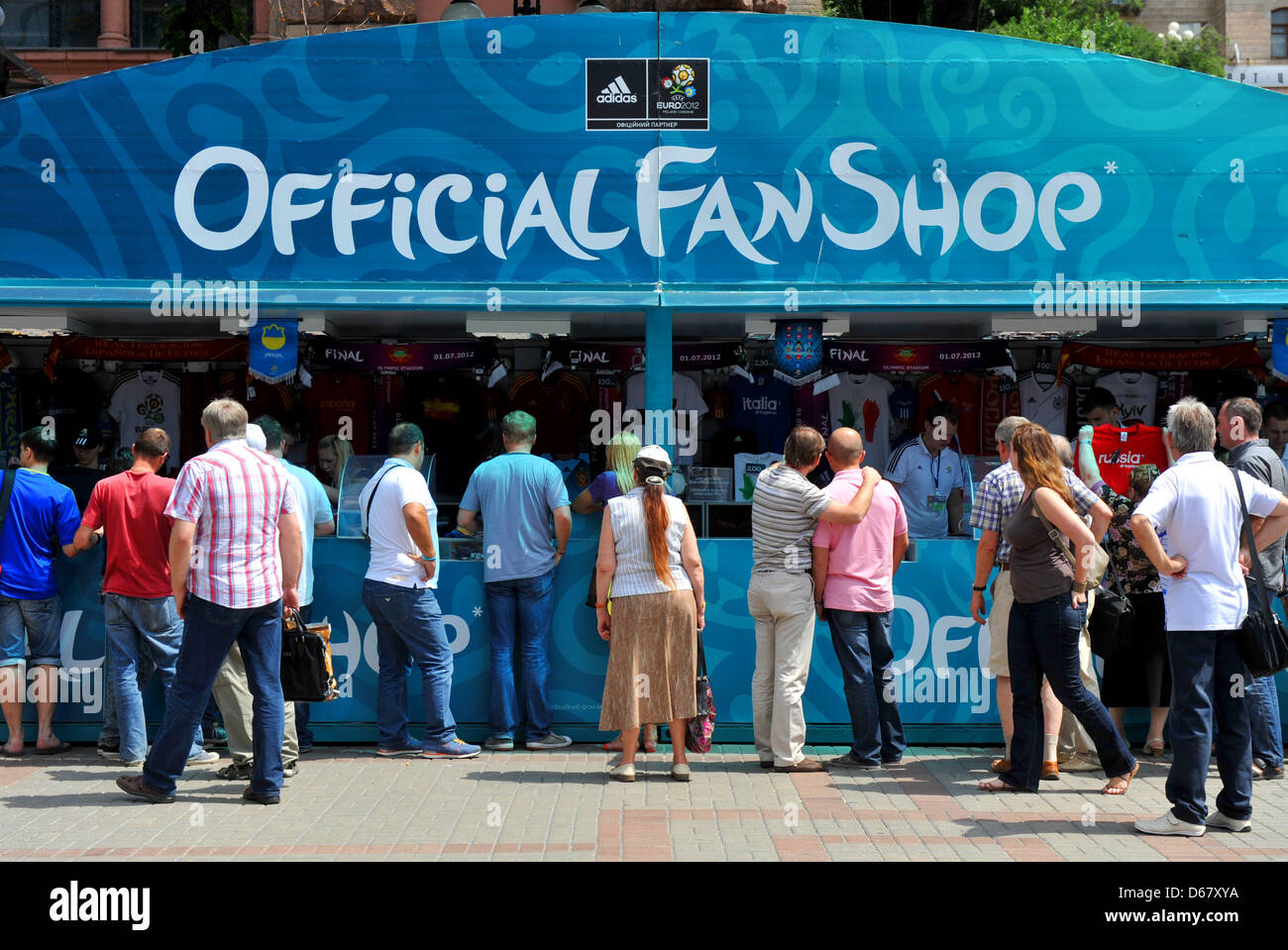 People stand in an official UEFA EURO 2012 fan shop in the fan zone in ...