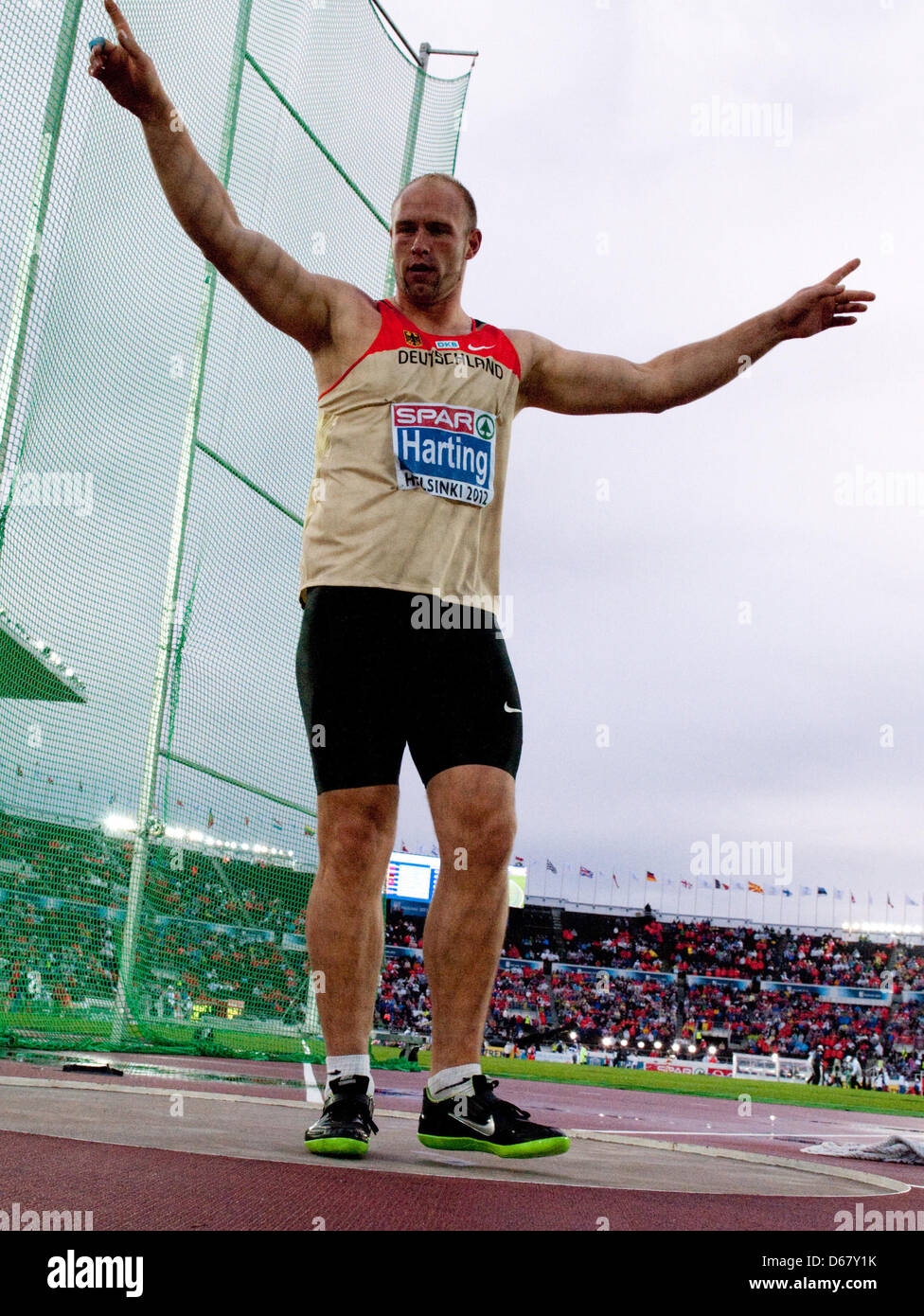 Robert Harting of Germany celebrates in the men's Discus Throw final ...