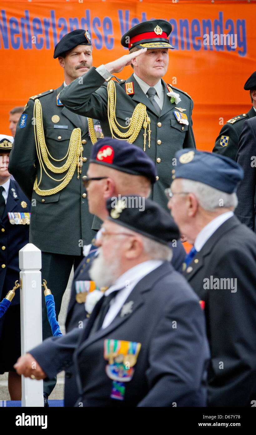 Prince Willem-Alexander of The Netherlands (C) attend the military ...