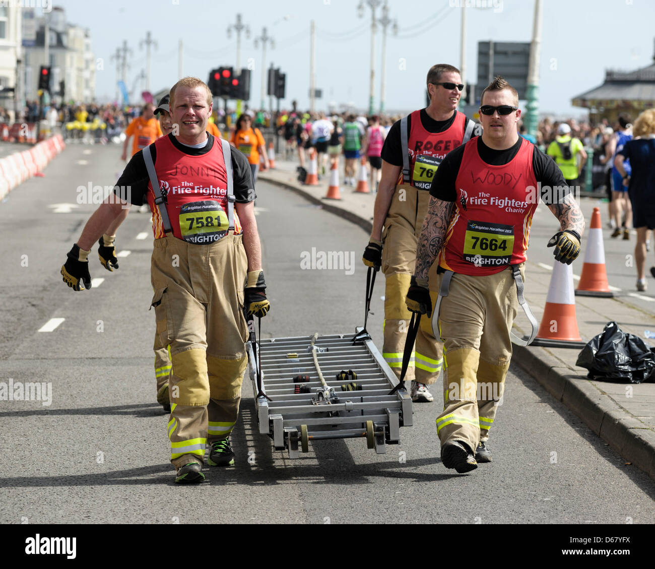 Brighton, UK, 14/04/2013 : Brighton Marathon. Fire Fighters carry a ...