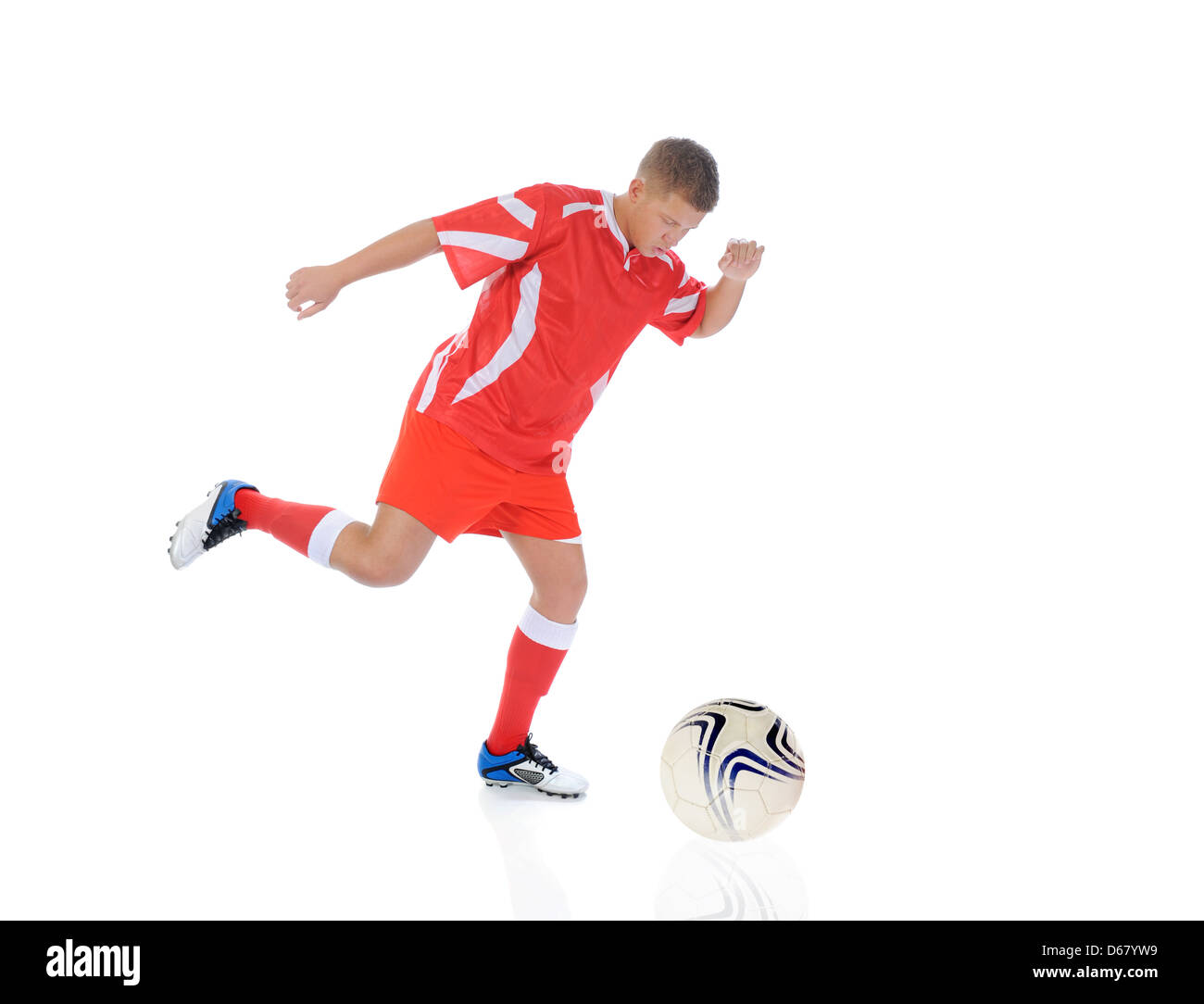 Boy playing football pass Cut Out Stock Images & Pictures - Alamy