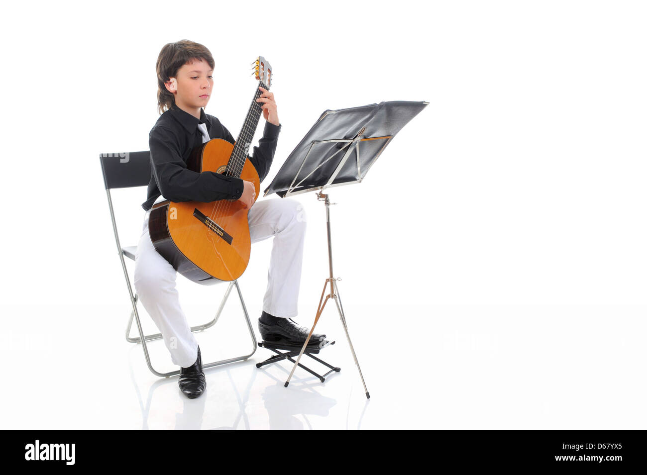 Little boy musician playing guitar Stock Photo - Alamy