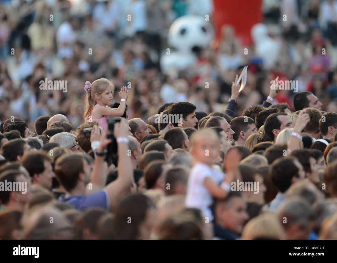 Spectators attend a charity concert at Independence Square in the city ...