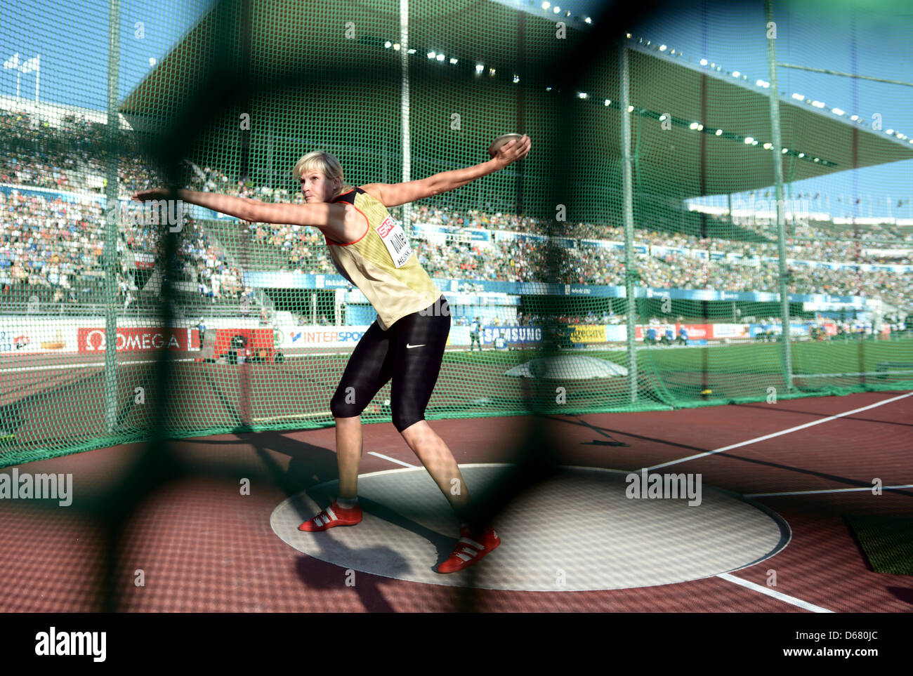 Nadine Mueller of Germany competes during the women's Discus Throw ...