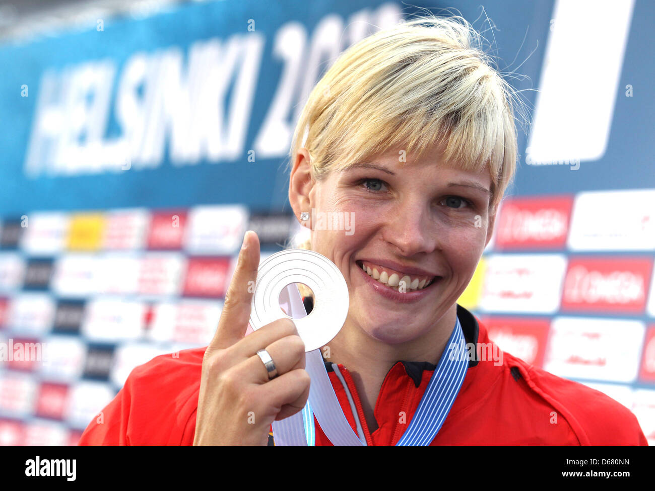 Nadine Mueller of Germany displays her silver medal for the Hammer ...