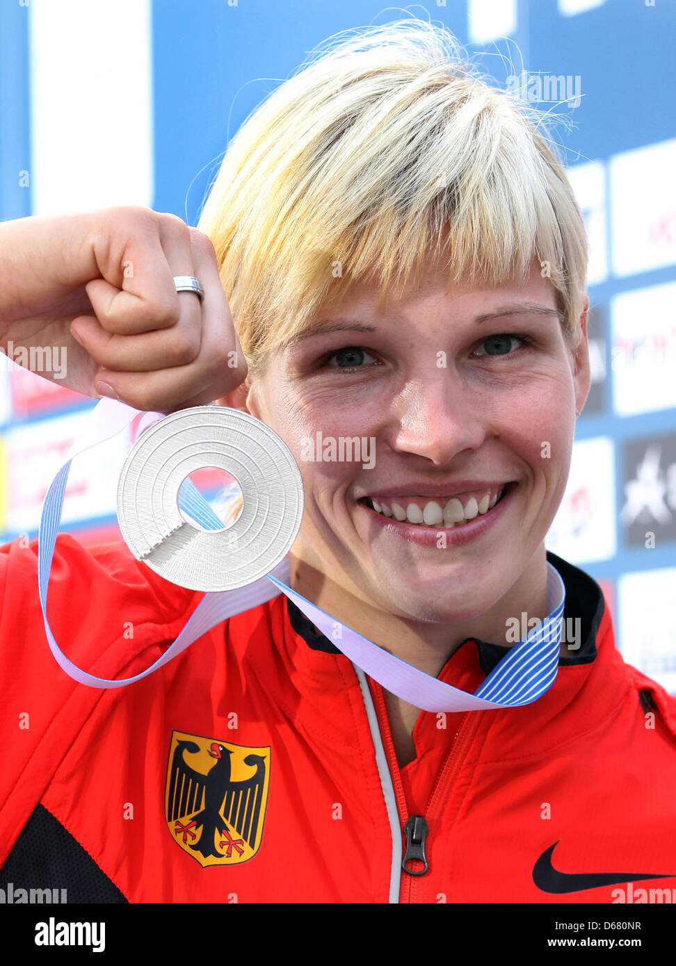 Nadine Mueller of Germany displays her silver medal for the Hammer ...