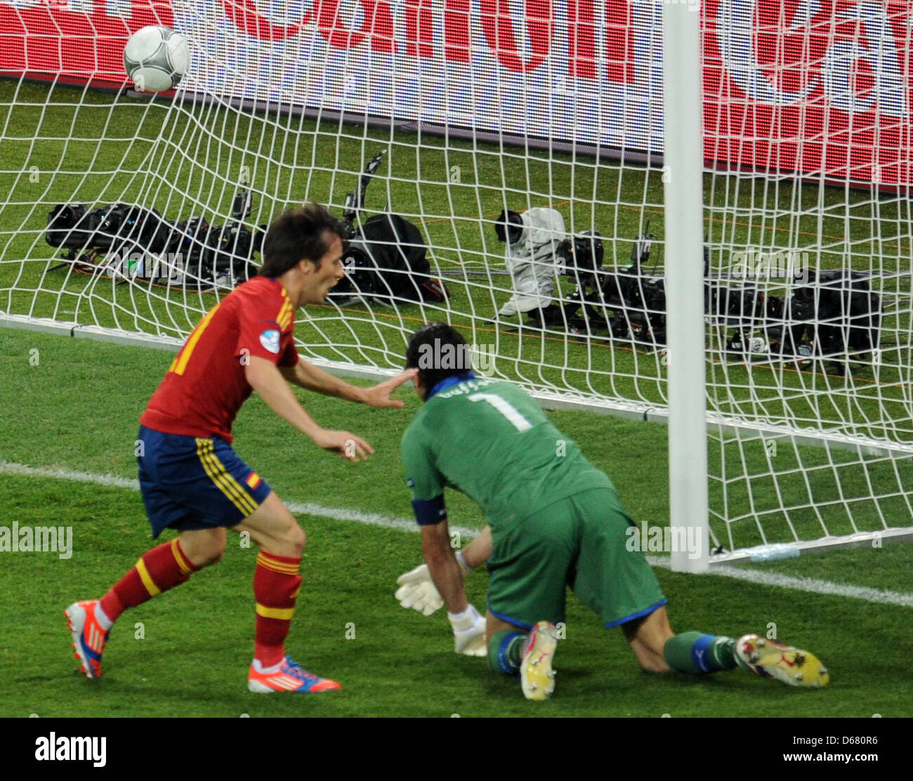 Spain's David Silva (R) next to Italy's goalkeeper Gianluigi Buffon ...