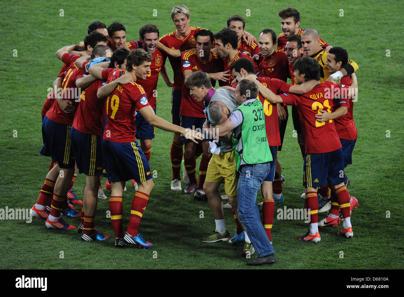 A streaker on the pitch next to the celebrating spanish team after the ...