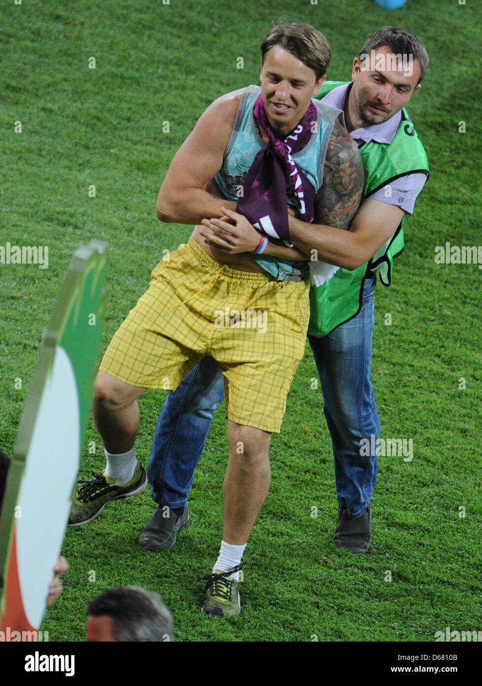 A streaker on the pitch after the UEFA EURO 2012 final soccer match ...