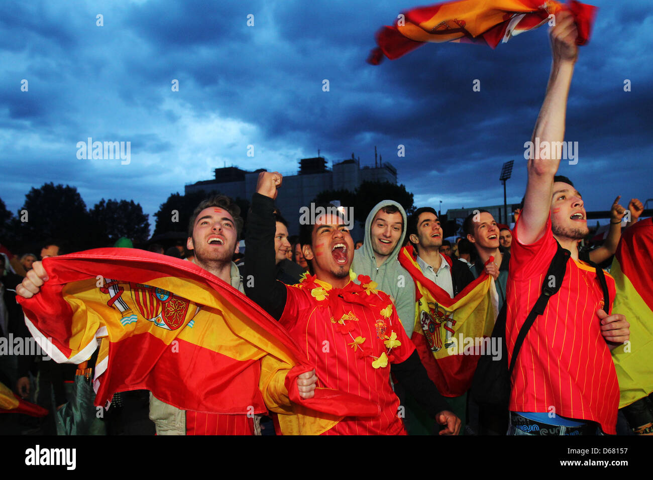 Spanish supporters cheer during watching the UEFA Euro 2012 final match ...