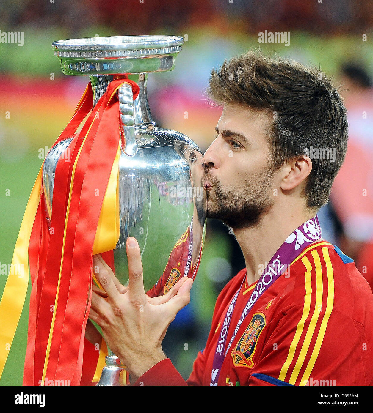 Spain's Gerard Pique kisses the UEFA cup after the UEFA EURO 2012 final ...