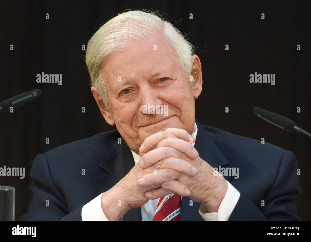 Former German Chancellor Helmut Schmidt smiles after he received the ...