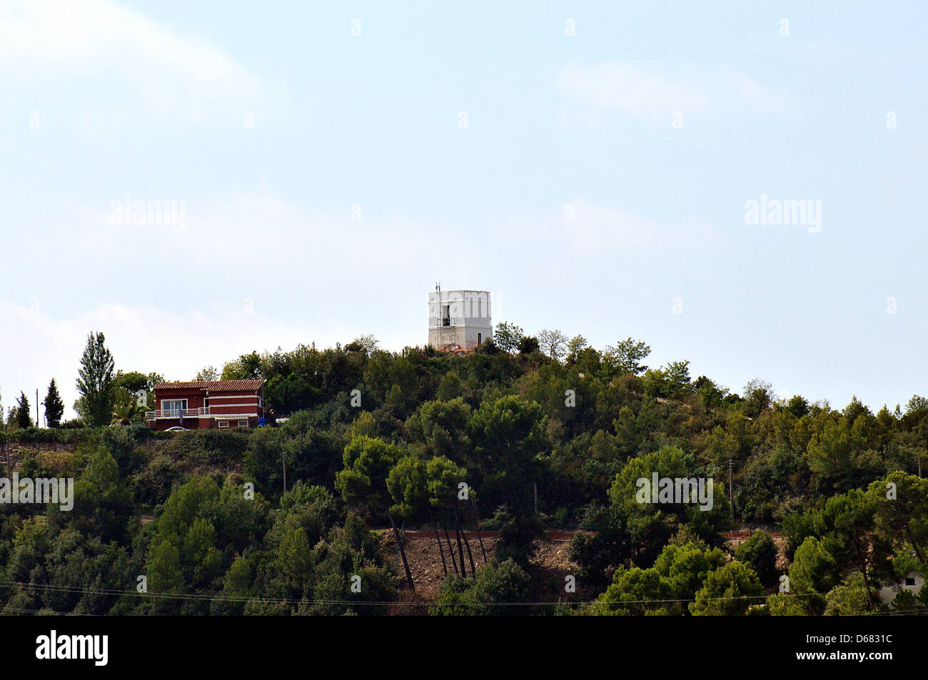 Mountain building in a white tower Stock Photo - Alamy