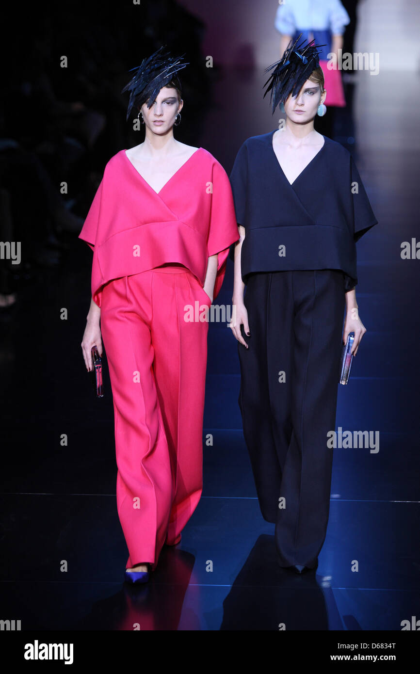Models wear creations of Italian designer Giorgio Armani as part of the ...