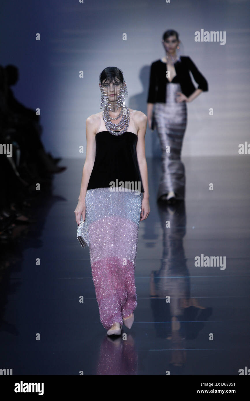 Models wear creations of Italian designer Giorgio Armani as part of the ...
