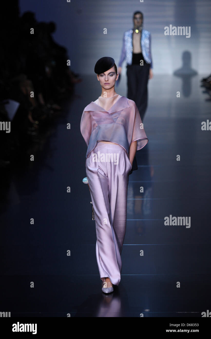 Models wear creations of Italian designer Giorgio Armani as part of the ...