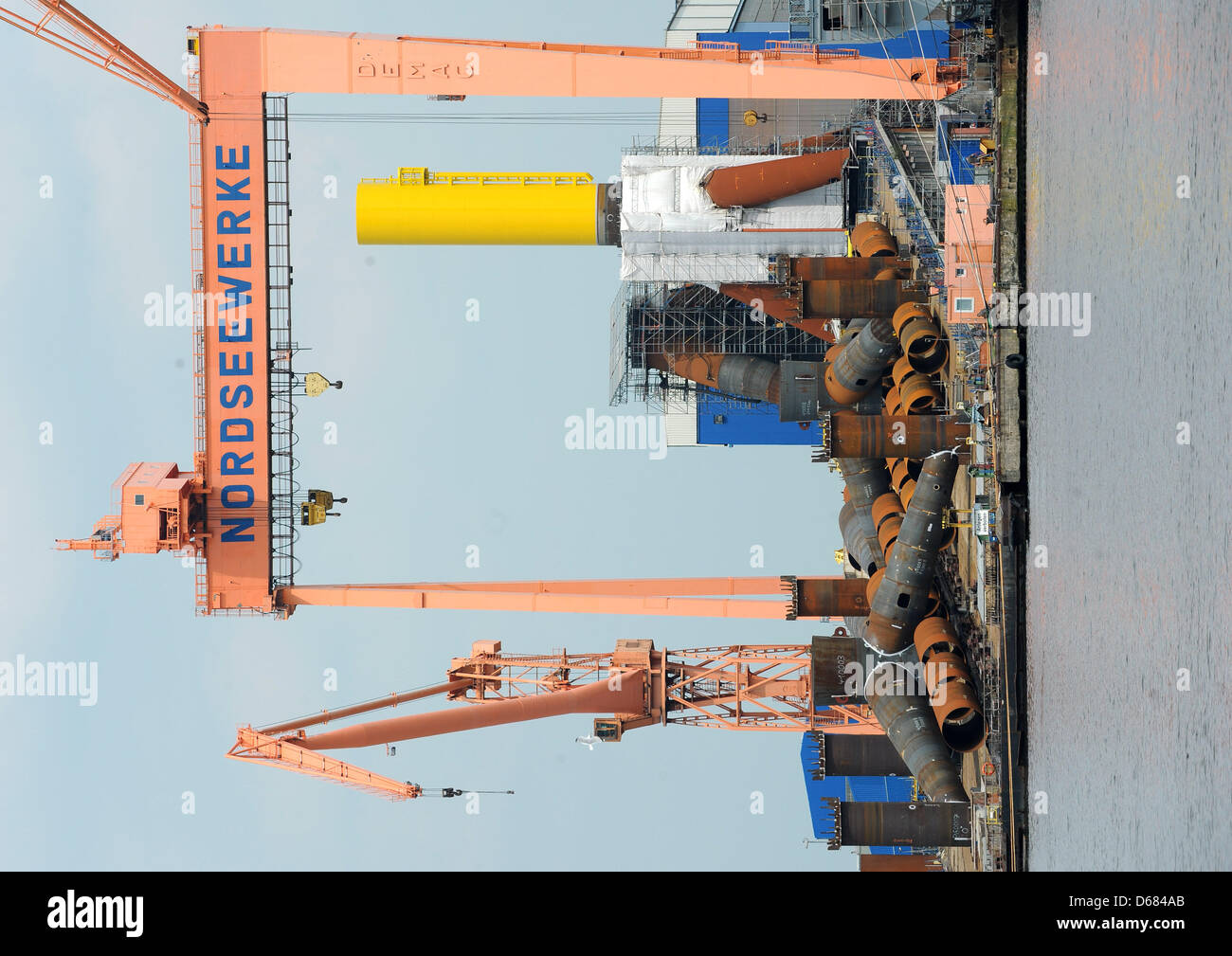 Parts of tripods are stored on sit on a pier "Nordseewerke" in Emden ...